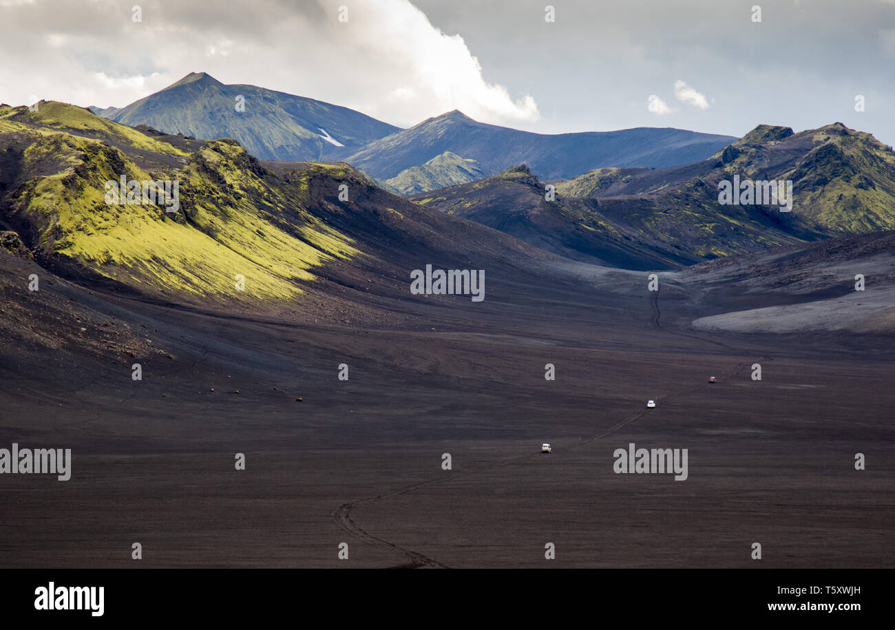Dramatic iceland landscape with a green hill and black lava looks like ...