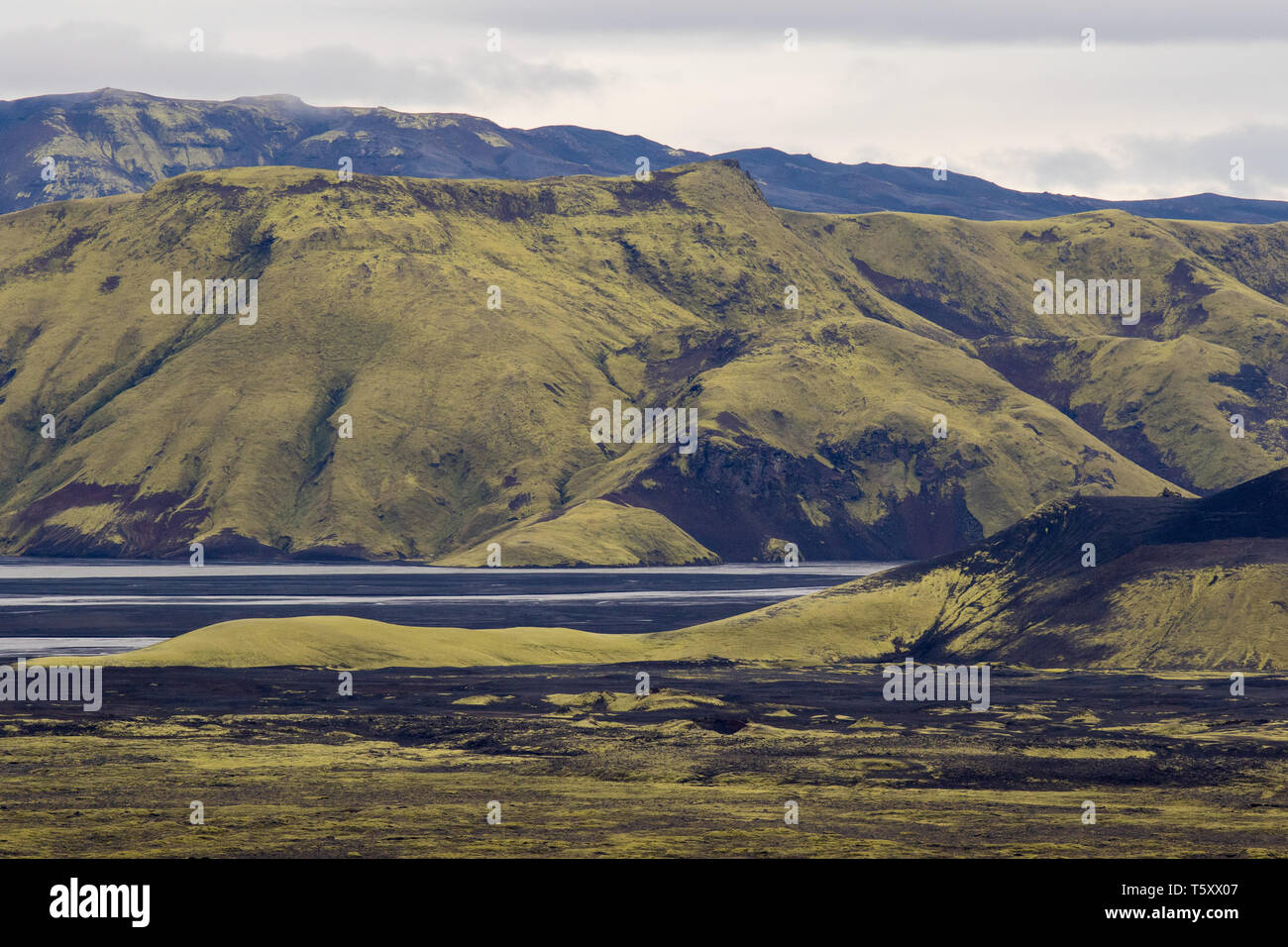 Dramatic iceland landscape with a green hill and black lava looks like ...