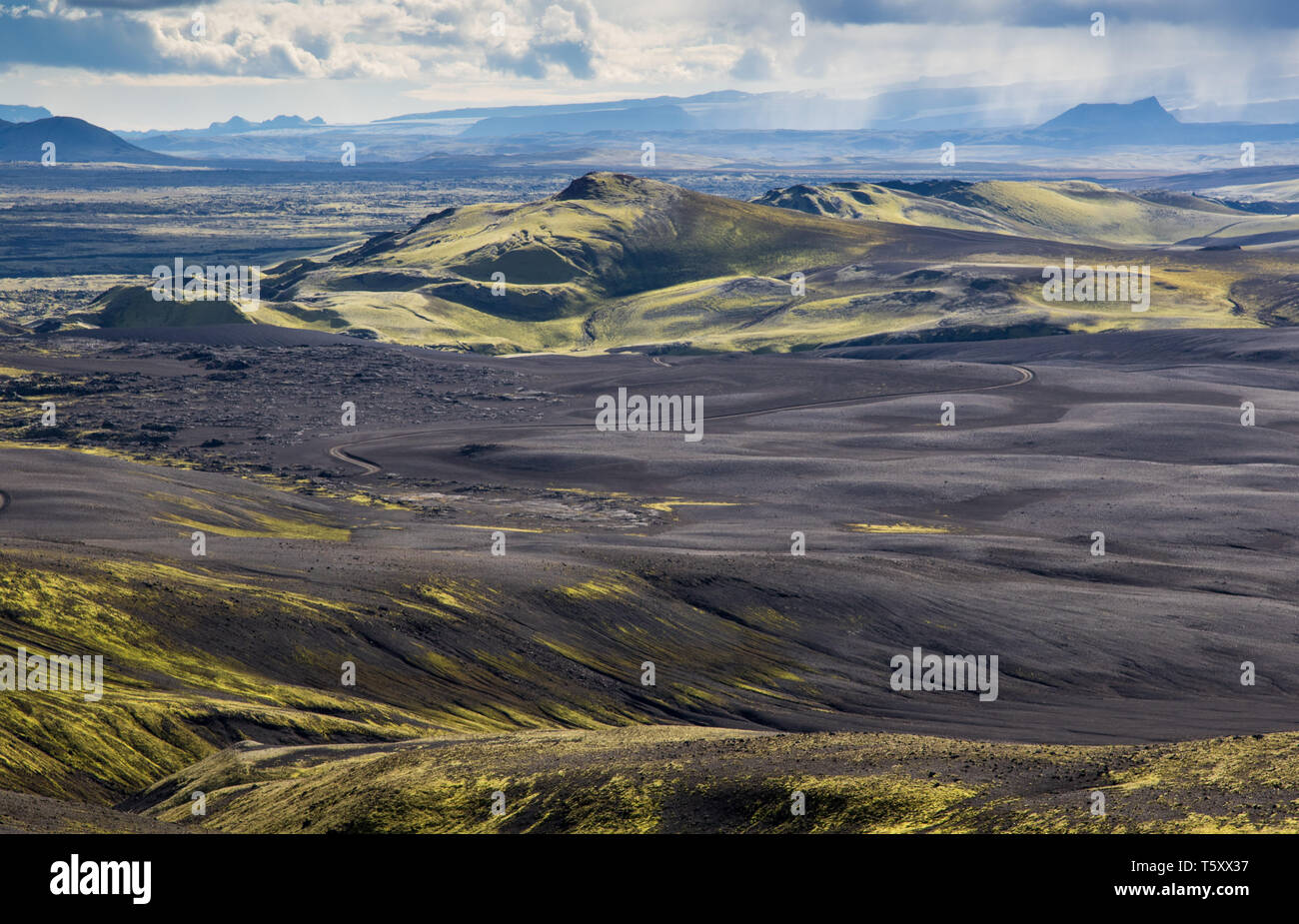 Dramatic iceland landscape with a green hill and black lava looks like ...