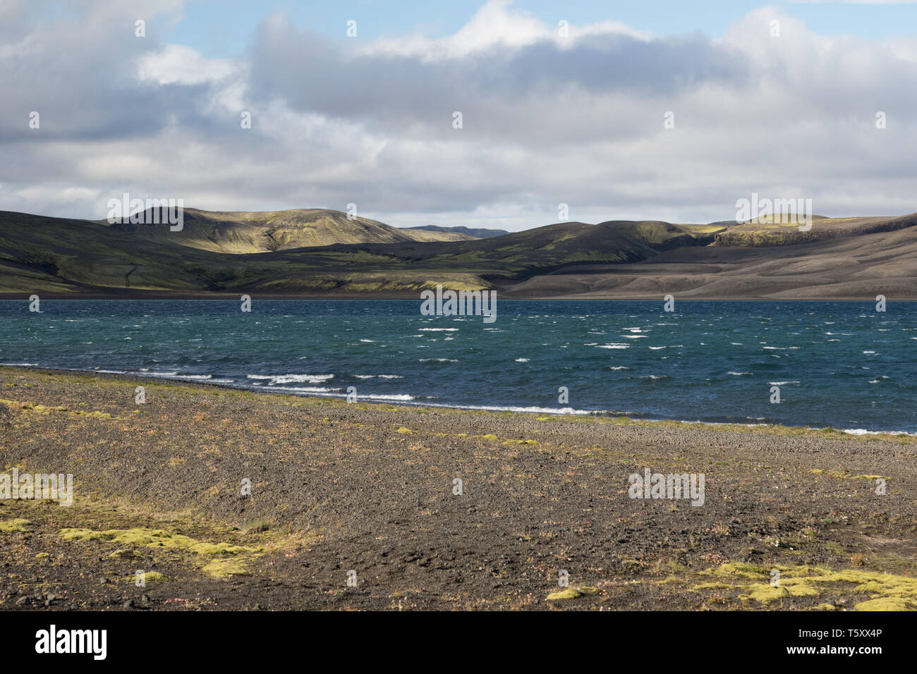 Dramatic iceland landscape with a green hill and black lava looks like ...