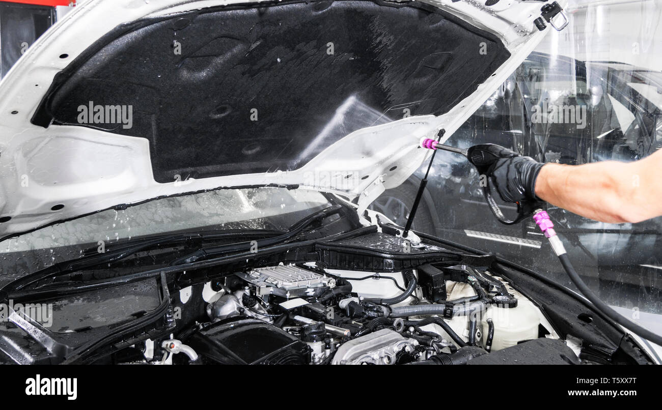 Car detailing. Manual car wash engine with pressure water. Washing car ...