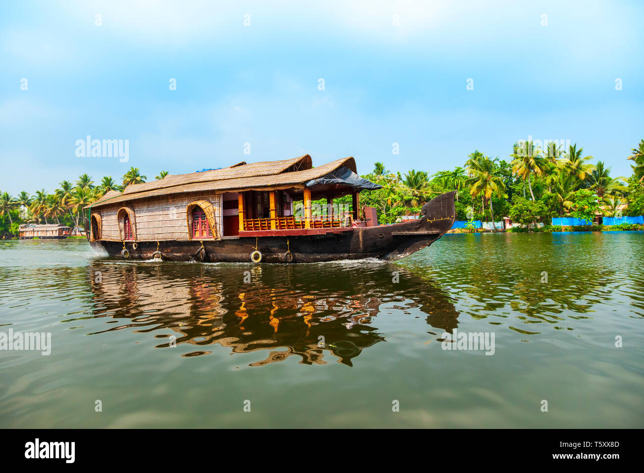 A houseboat sailing in Alappuzha backwaters in Kerala state in India ...