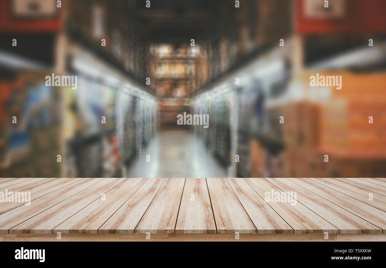 Empty wooden tabletop with blurred supermarket background for montage ...