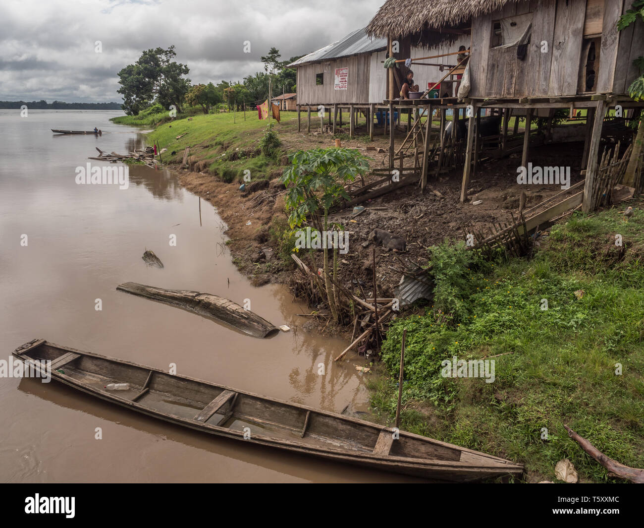 Amazon River, Peru - December 04 , 2018: View of village on the bank of ...