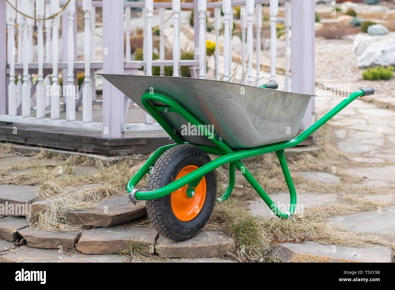 A hand cart with a wheel for garbage collection, construction and ...