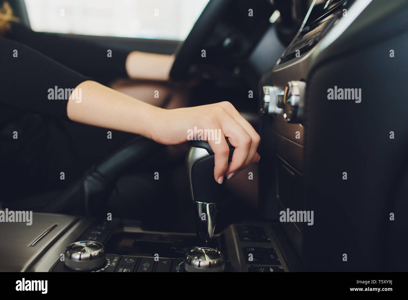 Female hand on automatic transmission lever, close up Stock Photo - Alamy