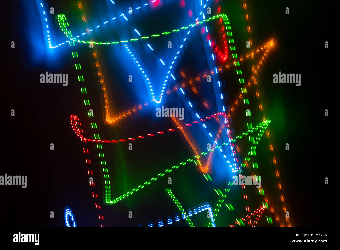 Intermittent colorful neon glowing strokes on black background Stock ...