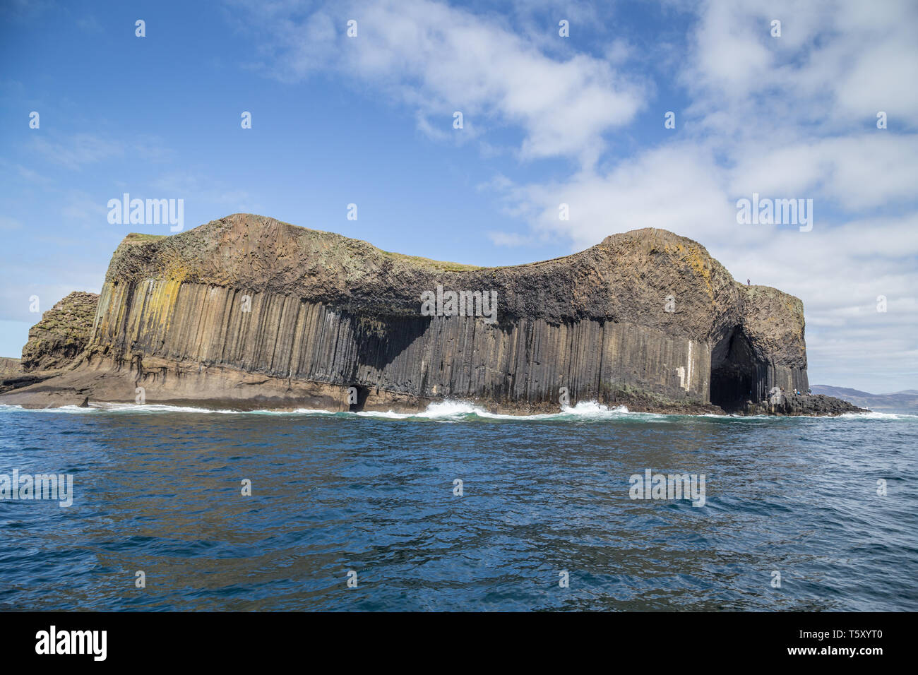 Tourists viewing the basalt columns at Fingal's Cave on the island of ...