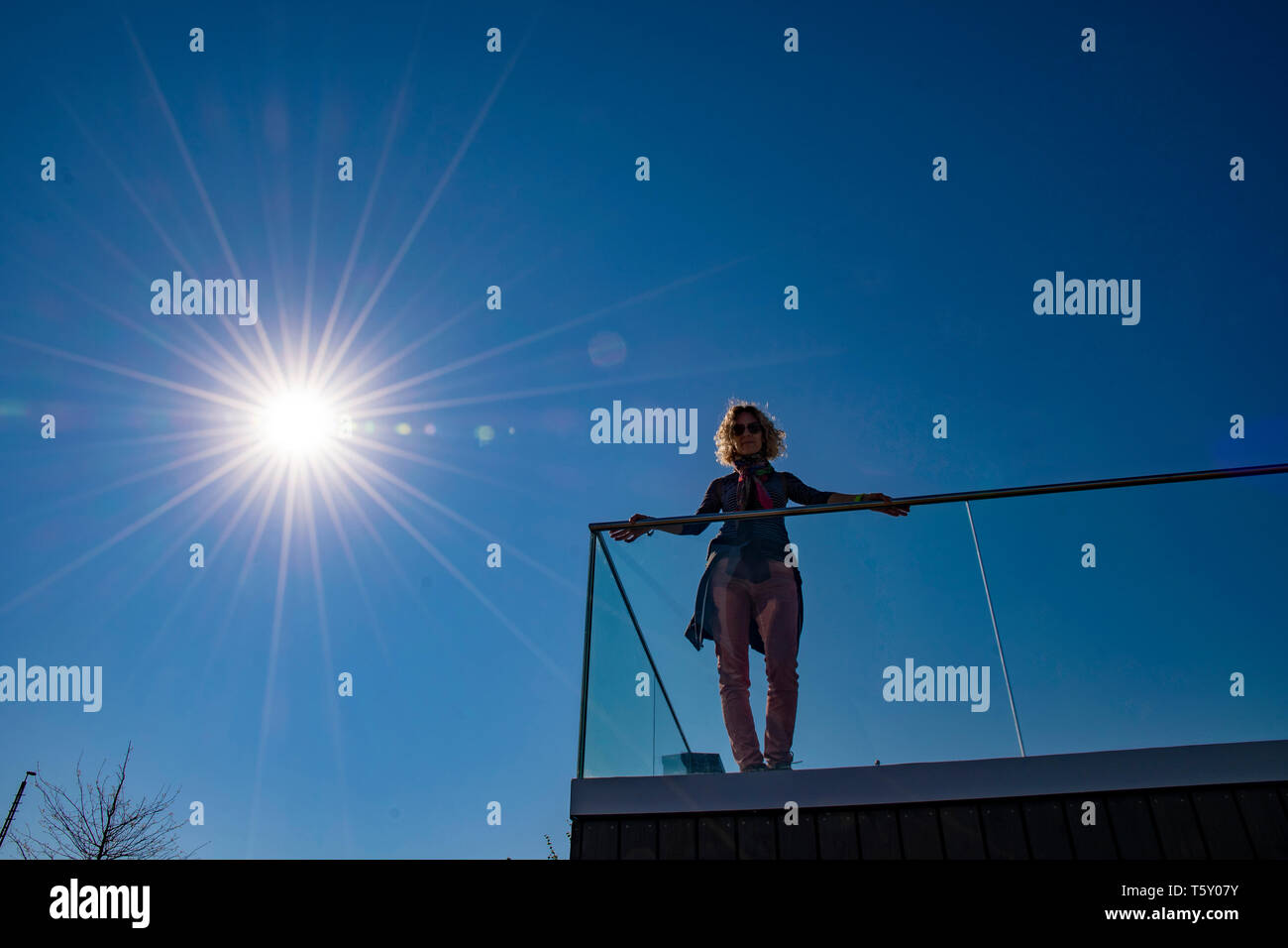 Modern glass house woman hi-res stock photography and images - Alamy