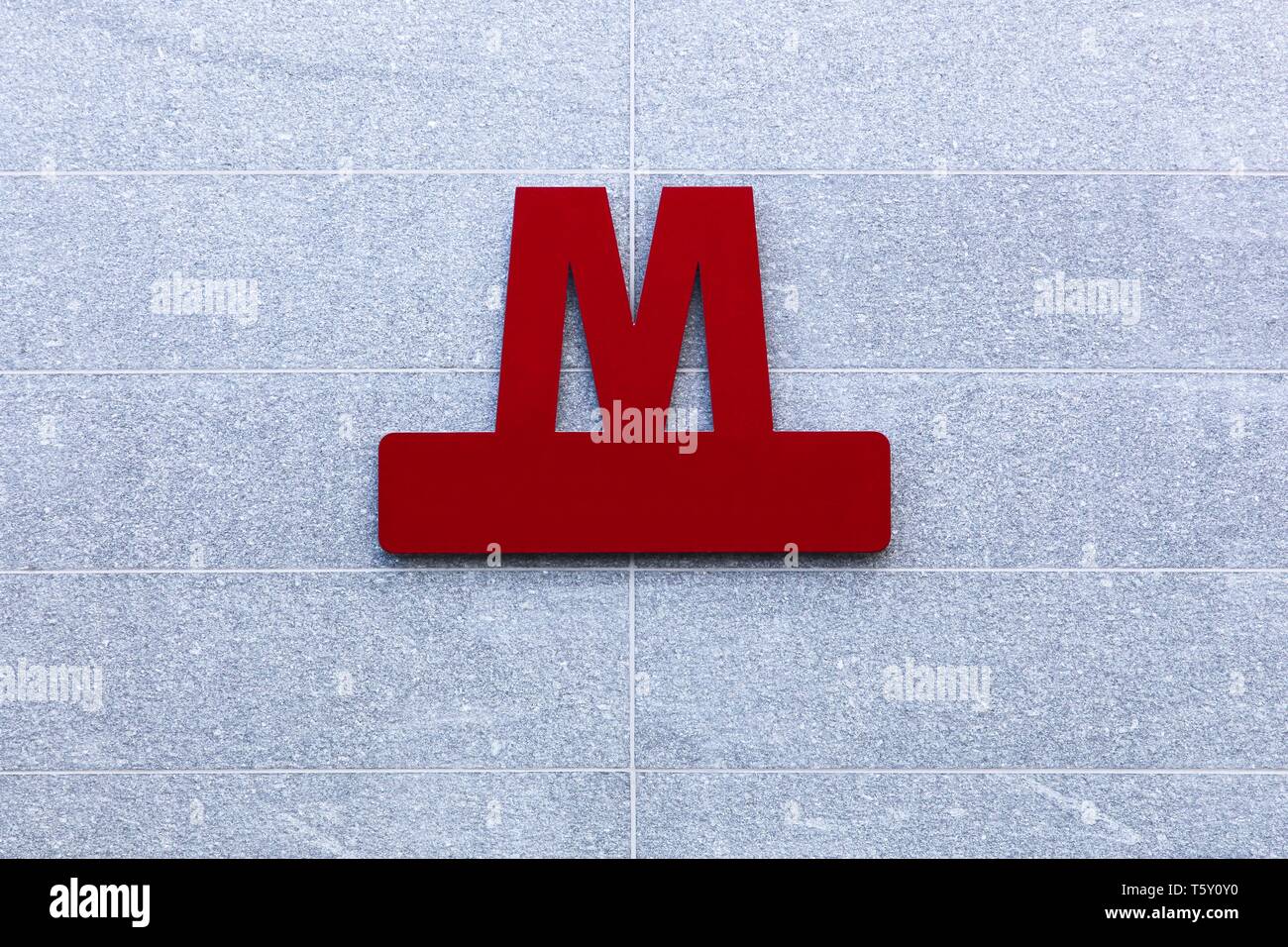 Copenhagen, Denmark - April 15, 2019: Red metro sign on a wall in ...