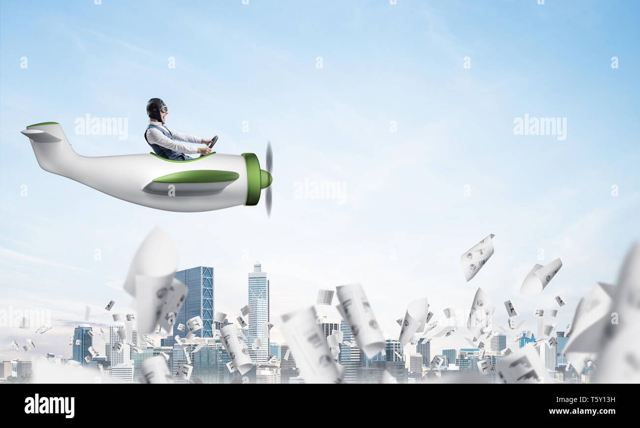 Businessman driving propeller plane above downtown Stock Photo - Alamy