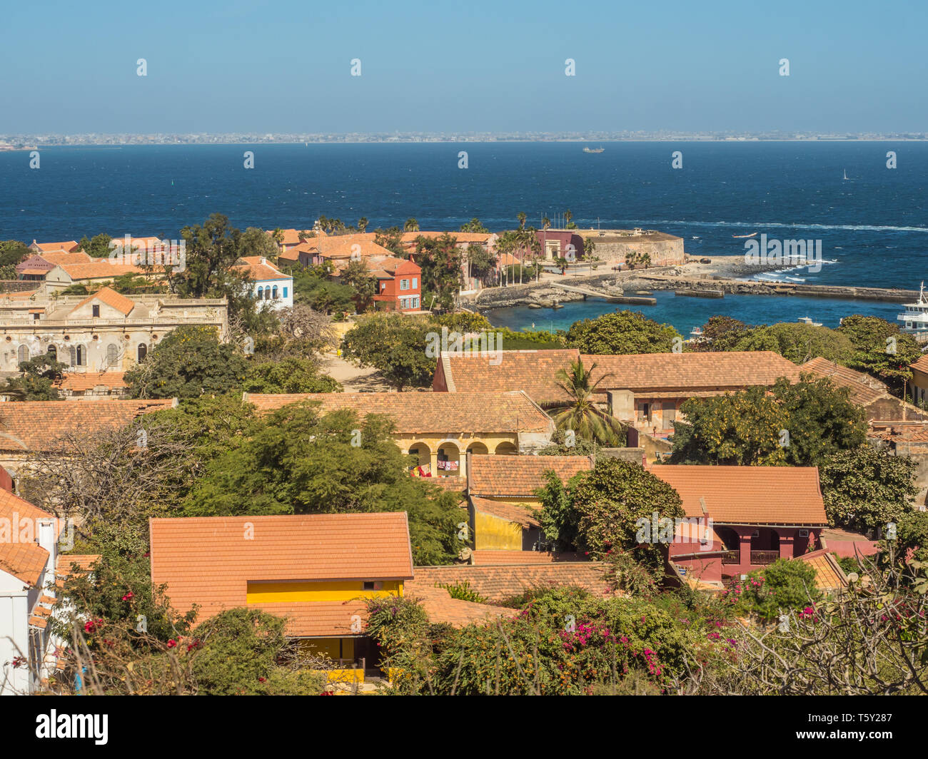 Goree, Senegal - February 2, 2019: View of houses with red roofing on ...
