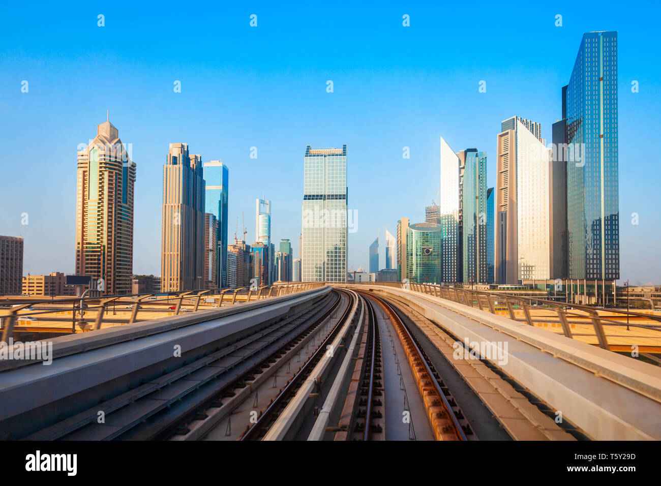 Dubai Metro train track and Dubai city skyline in UAE Stock Photo - Alamy