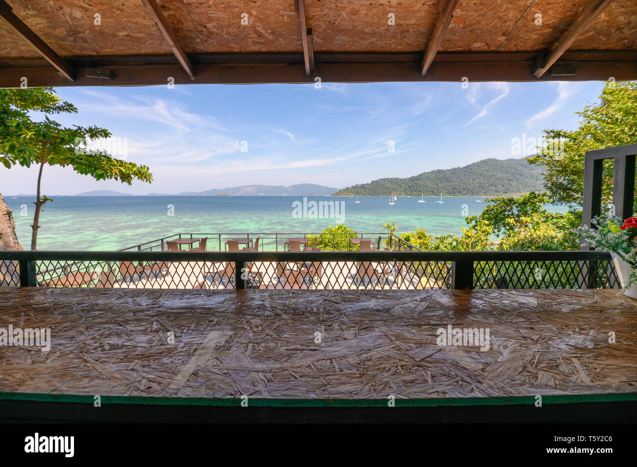 Wooden tabletop with roof in patio on tropical sea background Stock ...