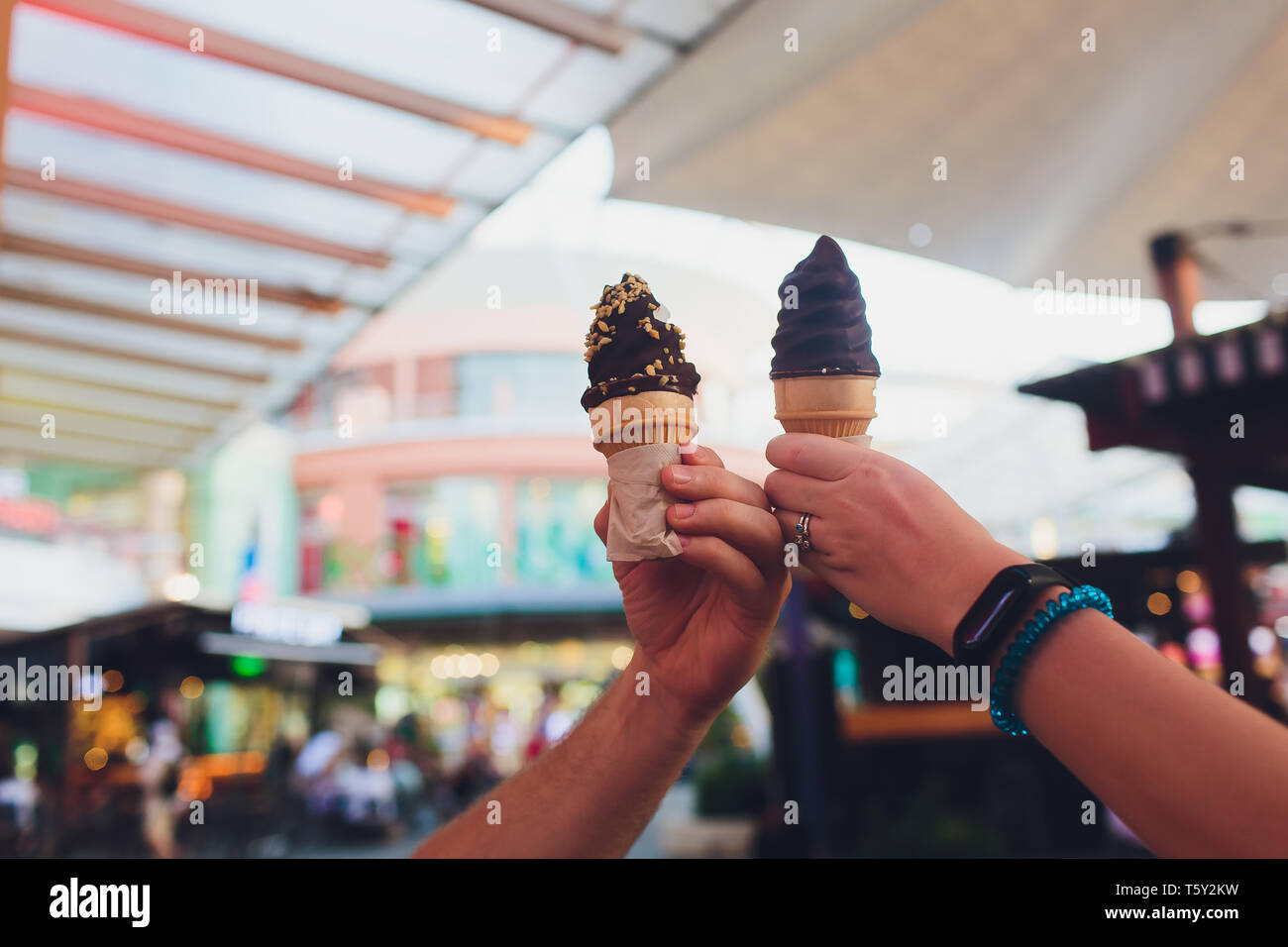 Hand holding chocolate triple scoop ice cream Stock Photo - Alamy
