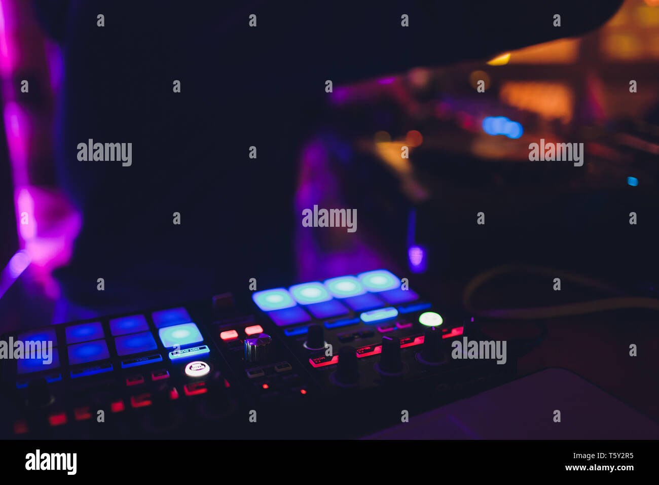 Digital midi controller panel with colorful disco light, Dj turn table ...