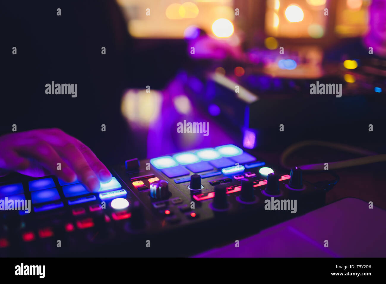 Digital midi controller panel with colorful disco light, Dj turn table ...