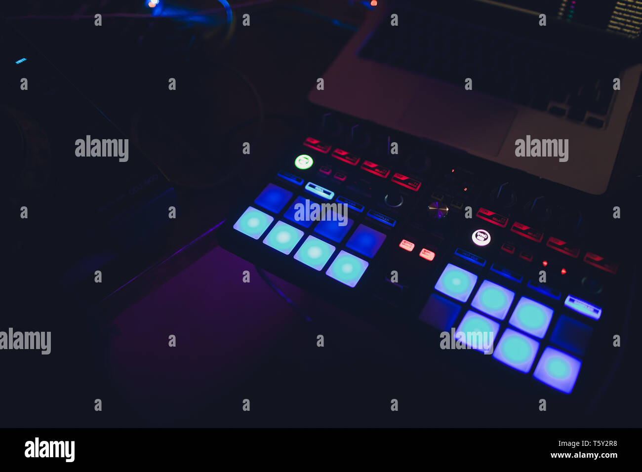 Digital midi controller panel with colorful disco light, Dj turn table ...