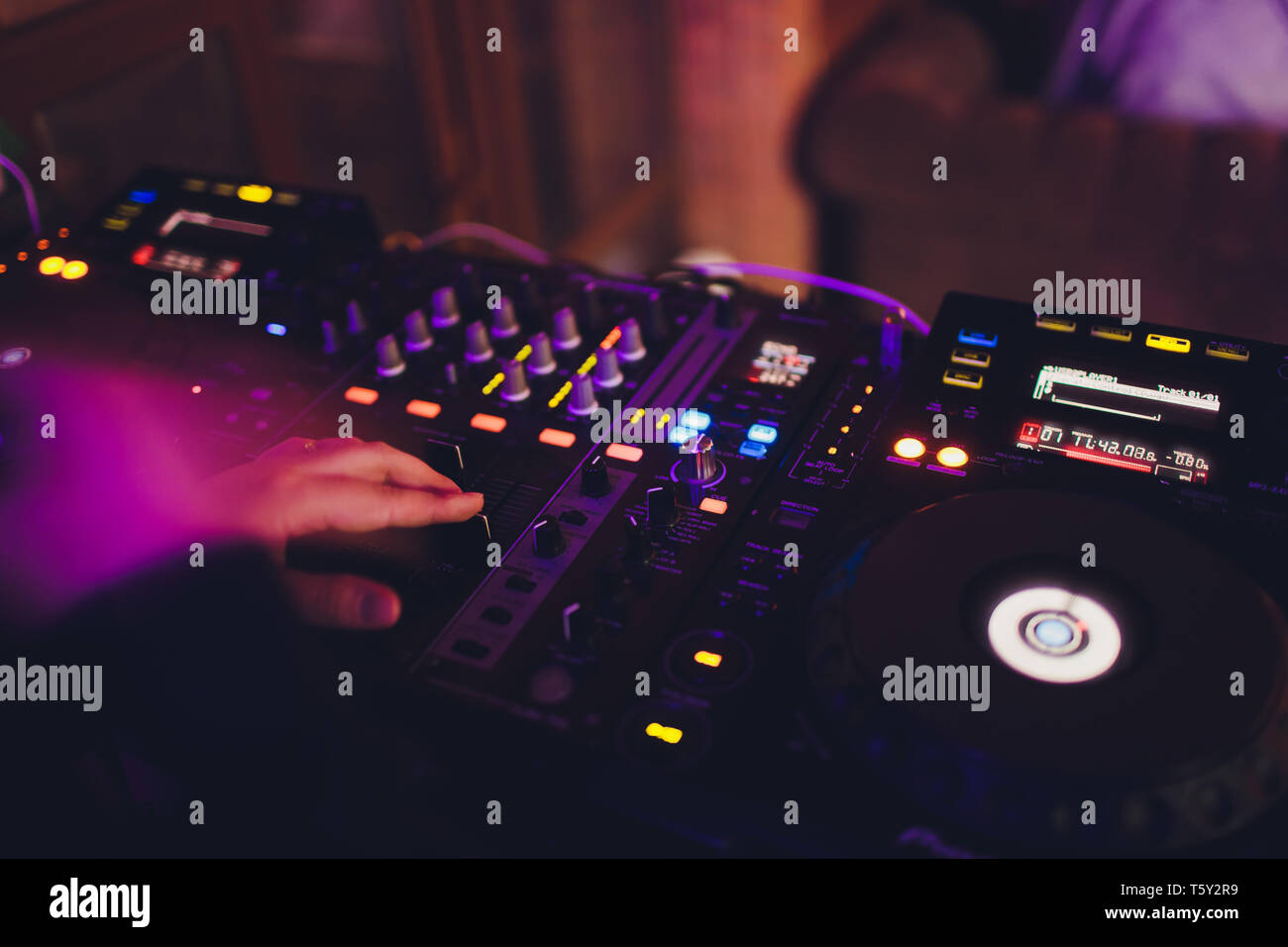 Digital midi controller panel with colorful disco light, Dj turn table ...