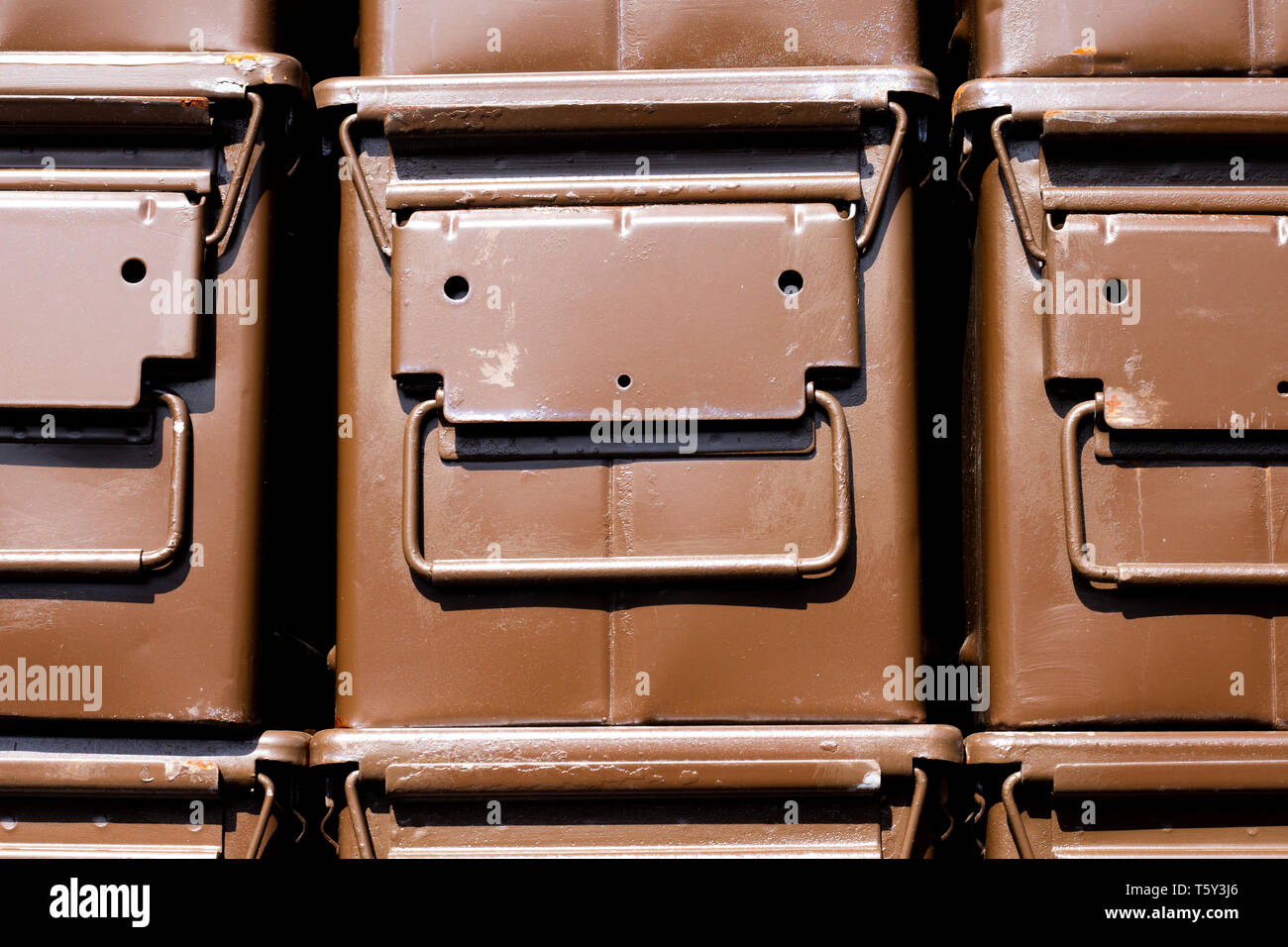 Stacked brown ammunition boxes designed for the safe transportation of ...
