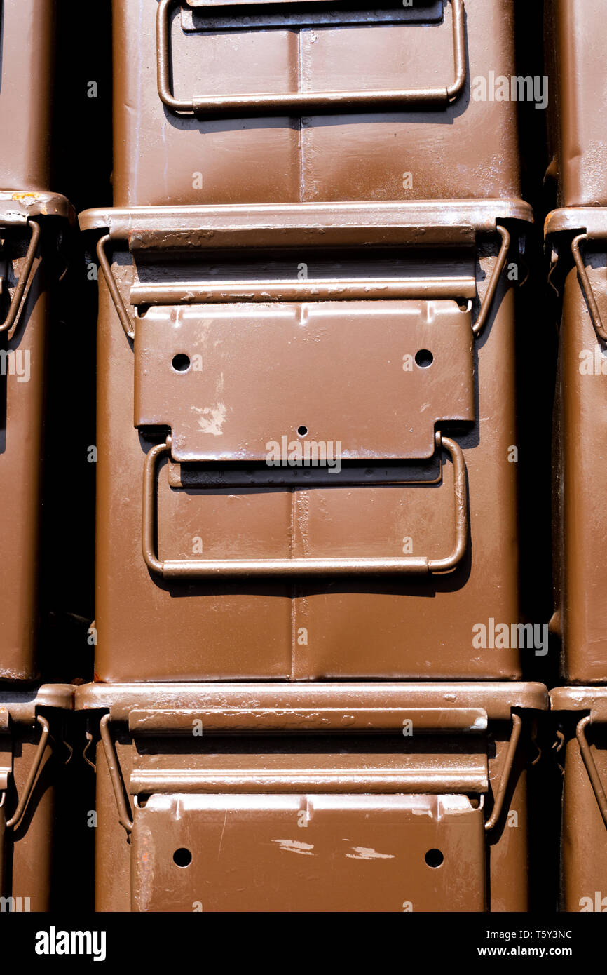 Stacked brown ammunition boxes designed for the safe transportation of ...