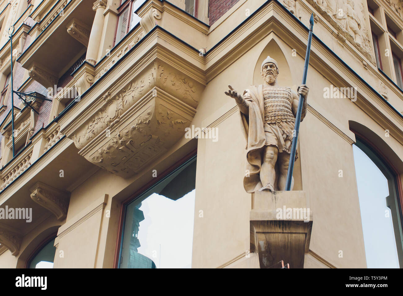 Men's statues in full growth on the facade of a beautiful old house in ...