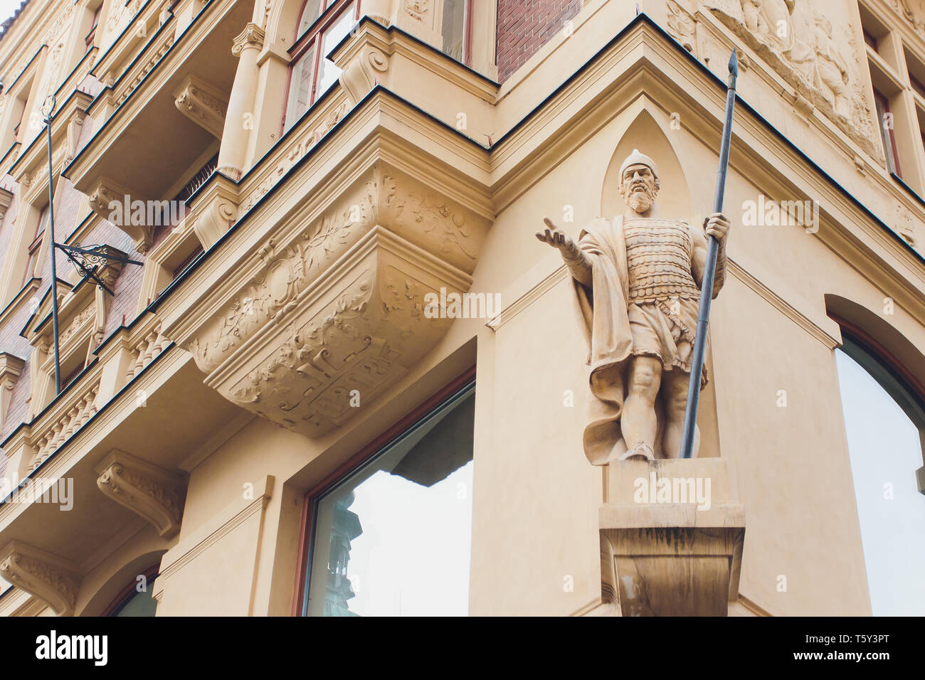 Men's statues in full growth on the facade of a beautiful old house in ...