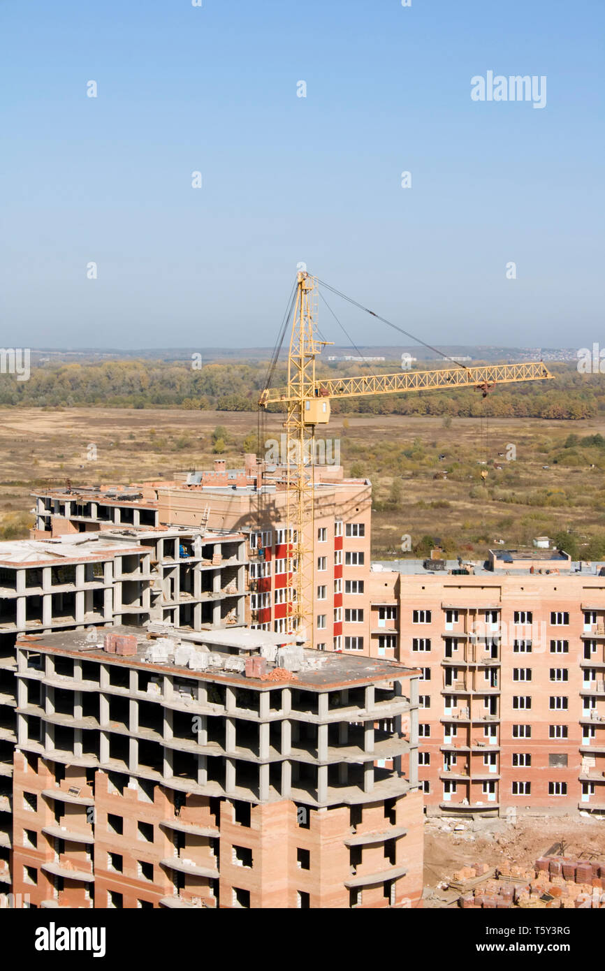 Elevating crane on a Building area. Vertical photo Stock Photo - Alamy
