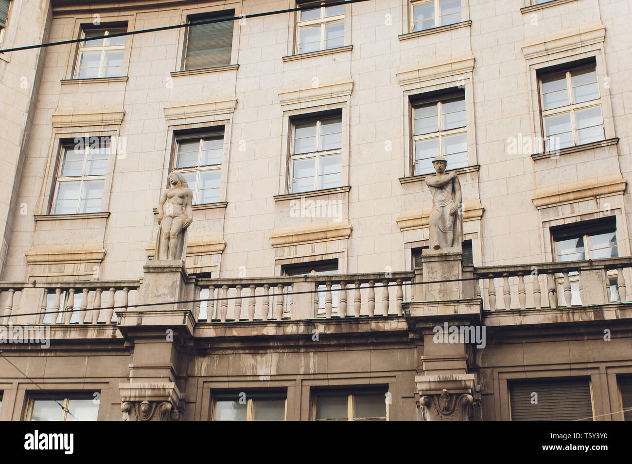 Men's statues in full growth on the facade of a beautiful old house in ...
