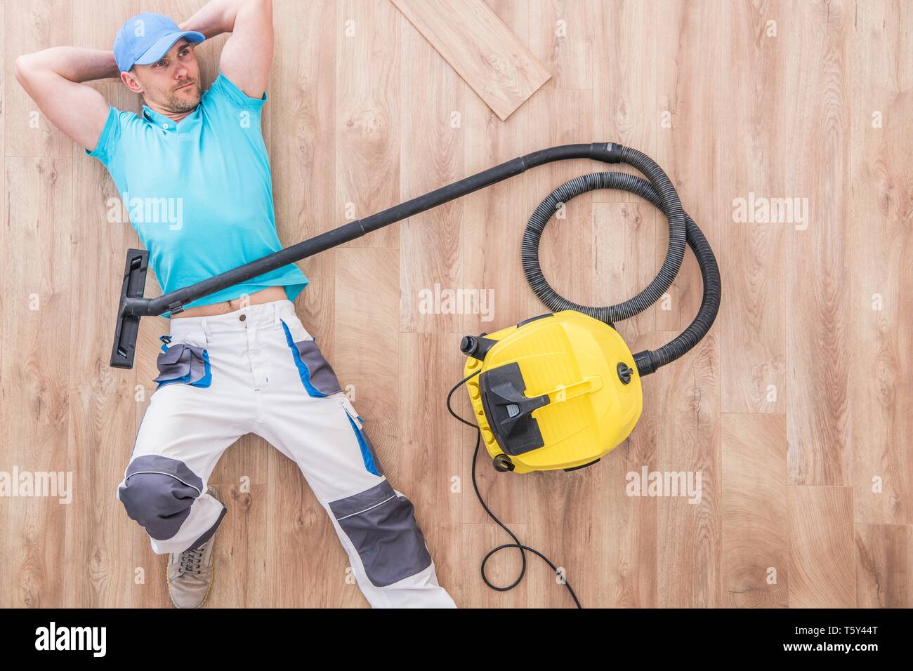Happy New Home Owner. Caucasian Men in His 30s Relaxing After Vacuuming ...