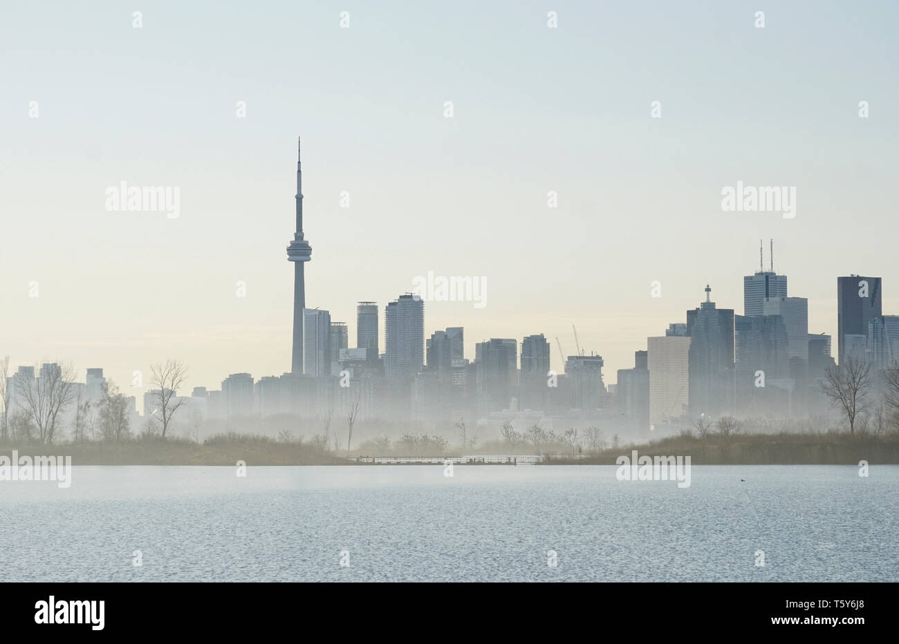 Sihouettes of Toronto waterfront landmark buildings in foggy haze in a ...