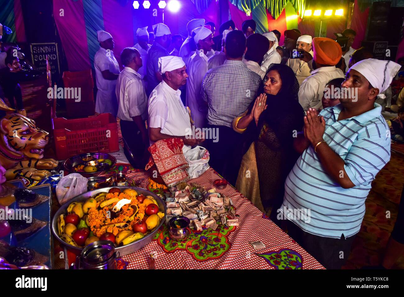 Devotees seen praying during the ritual. Jagran is a Hindu ritual ...
