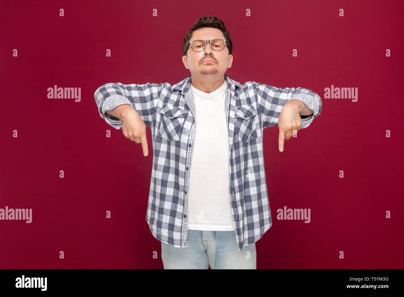 Here and now. Portrait of serious handsome middle aged bossy man in ...