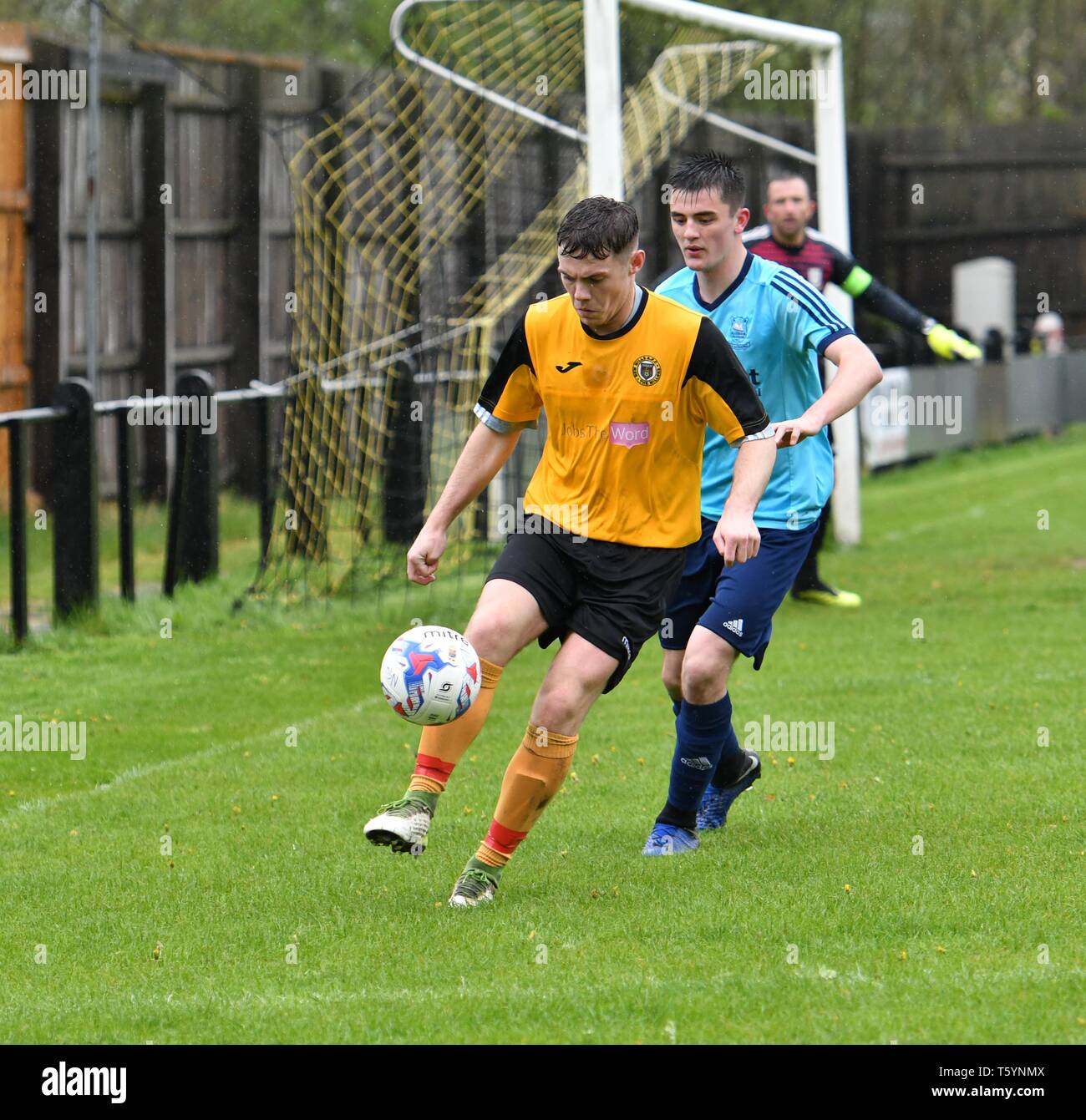 Football action from the North West Counties match between New Mills ...