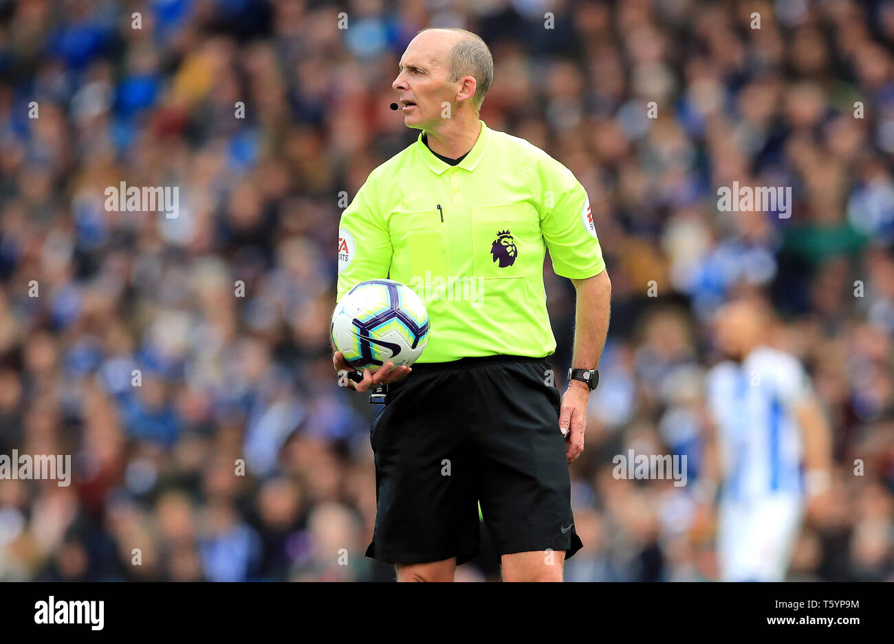 Referee Mike Dean during the Premier League match at the AMEX Stadium ...