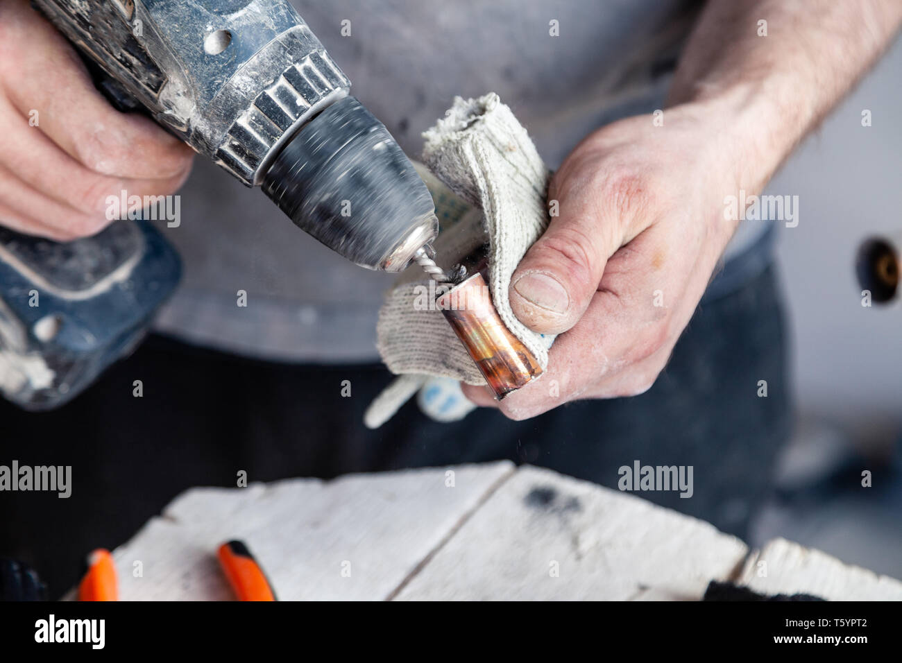 Closeup worker plumber master cleaning copper pipes with professional ...