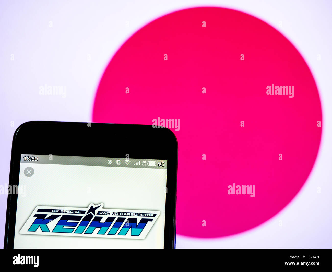 In this photo illustration a Keihin Corporation logo seen displayed on ...