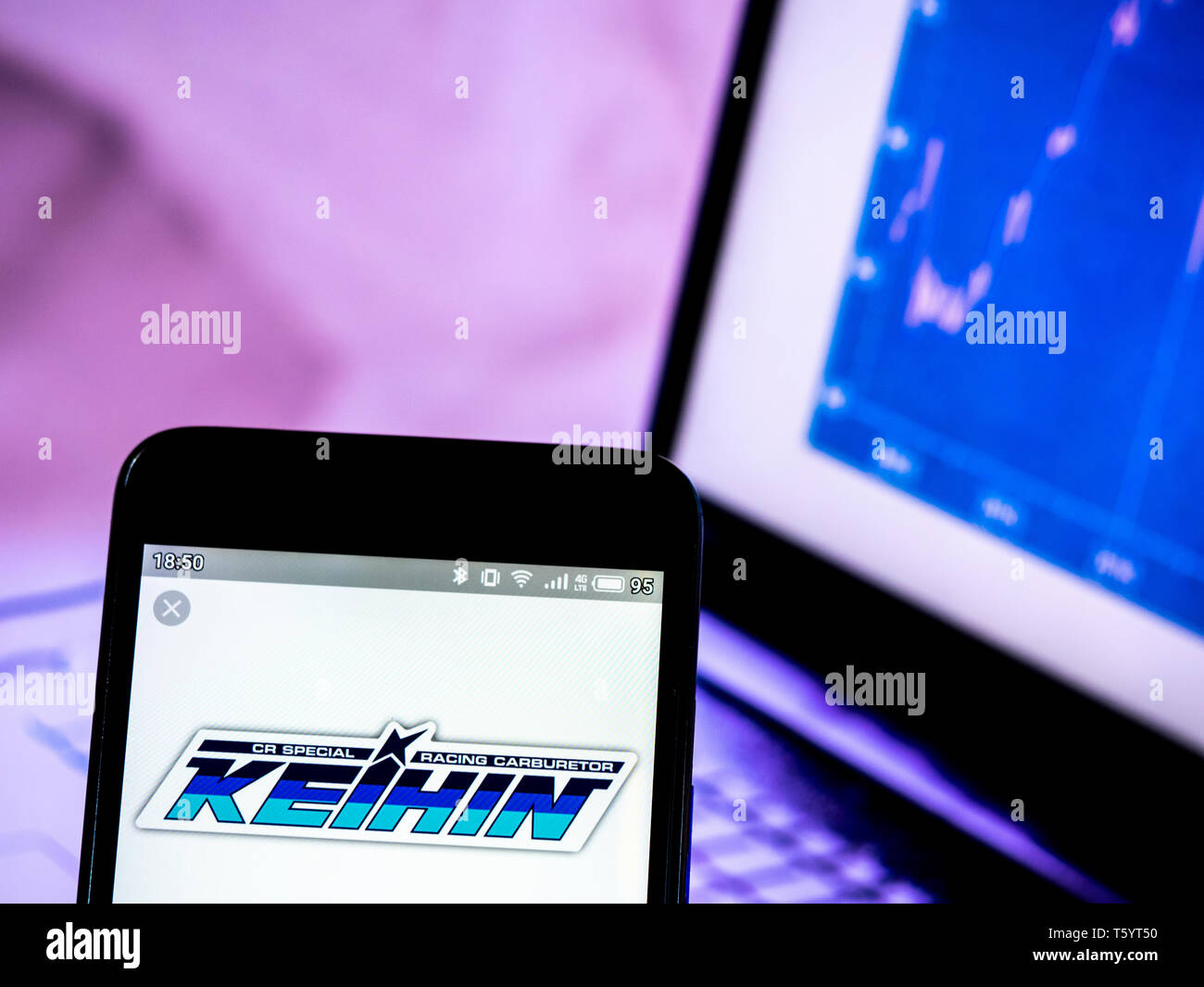 In this photo illustration a Keihin Corporation logo seen displayed on ...