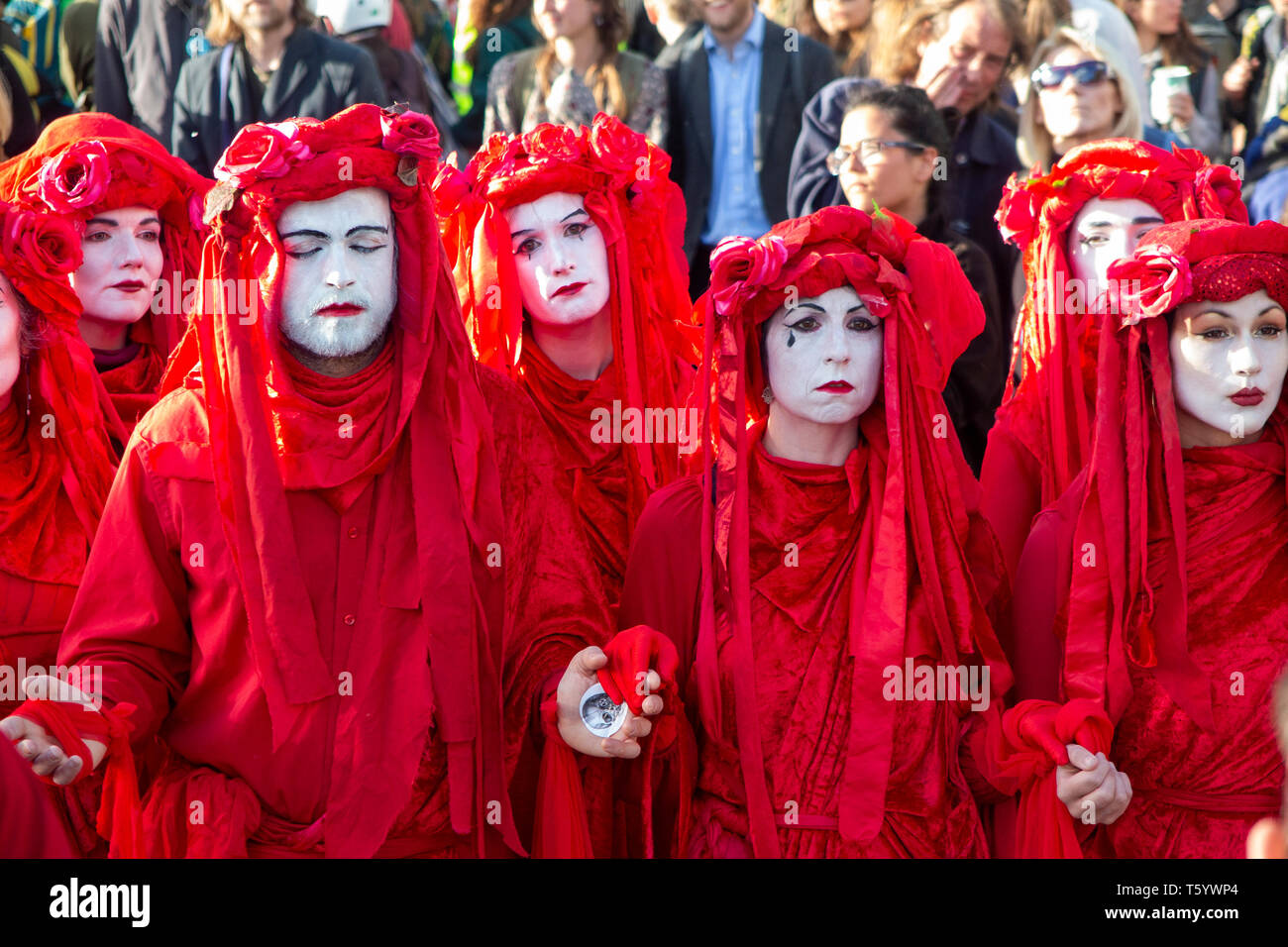 Red brigade environmental activists dressed as blood tears representing ...