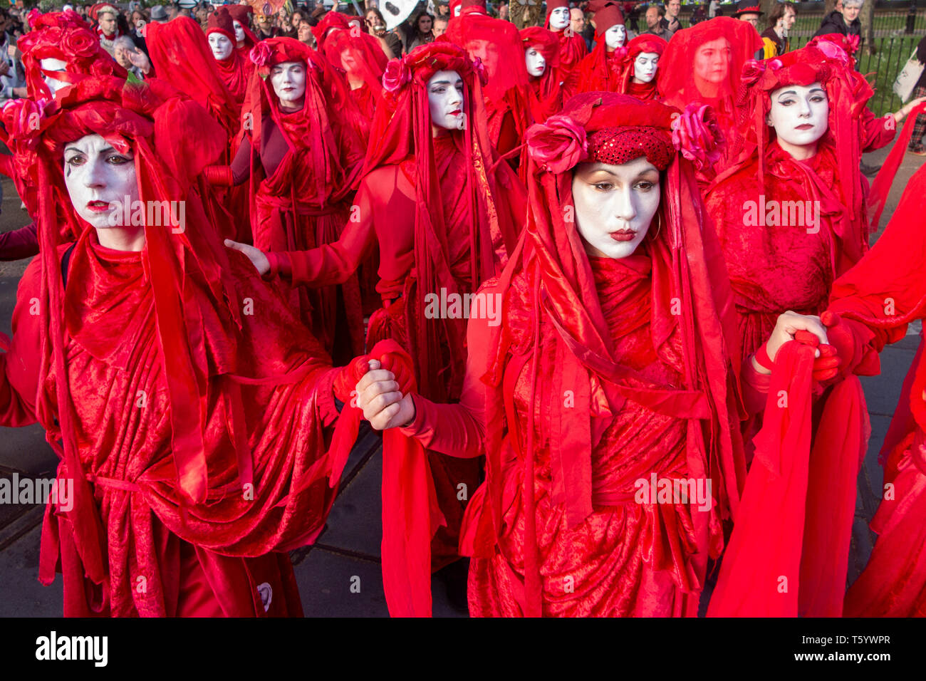 Red brigade environmental activists dressed as blood tears representing ...