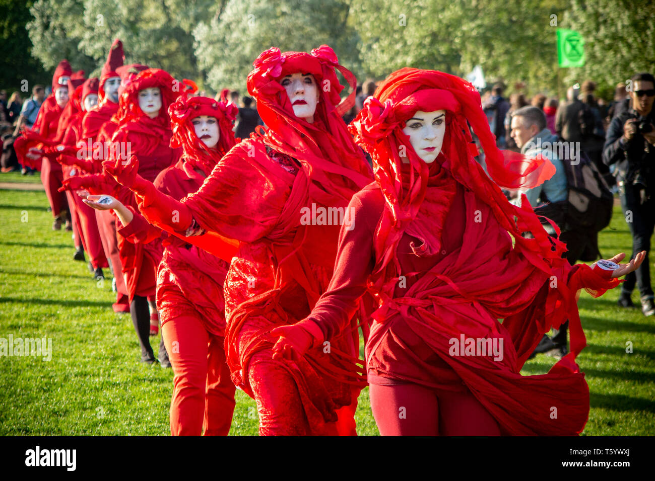 Red brigade environmental activists dressed as blood tears representing ...