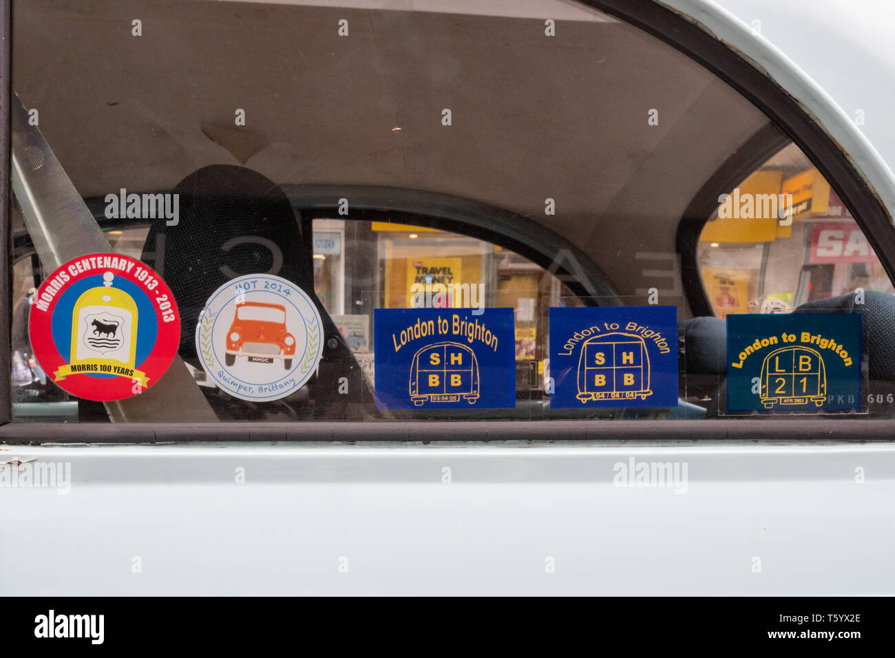 Car stickers on a classic Morris Minor, including three London to ...