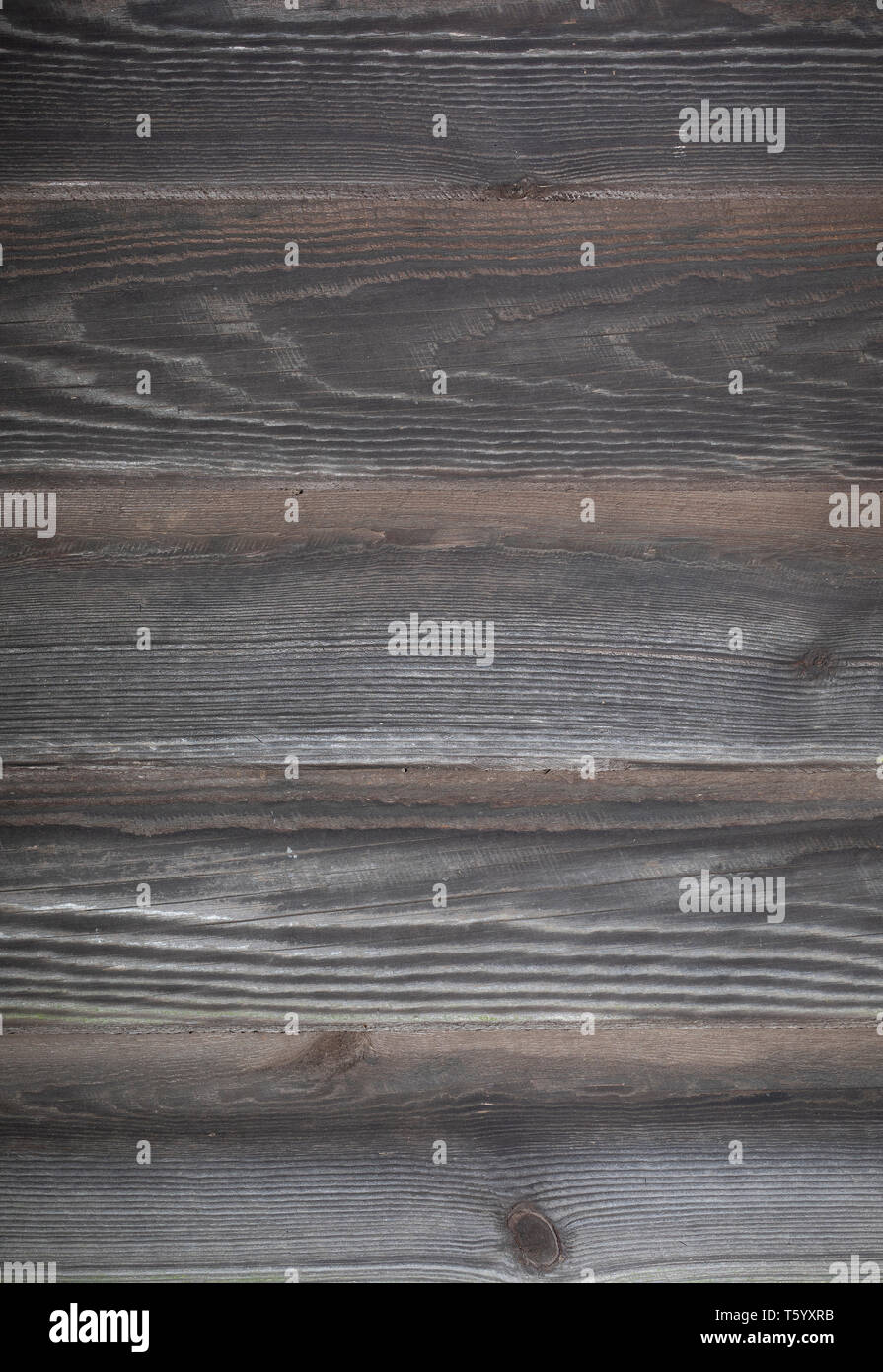 Exterior view of weathered, unpainted barn board. Vertical background ...