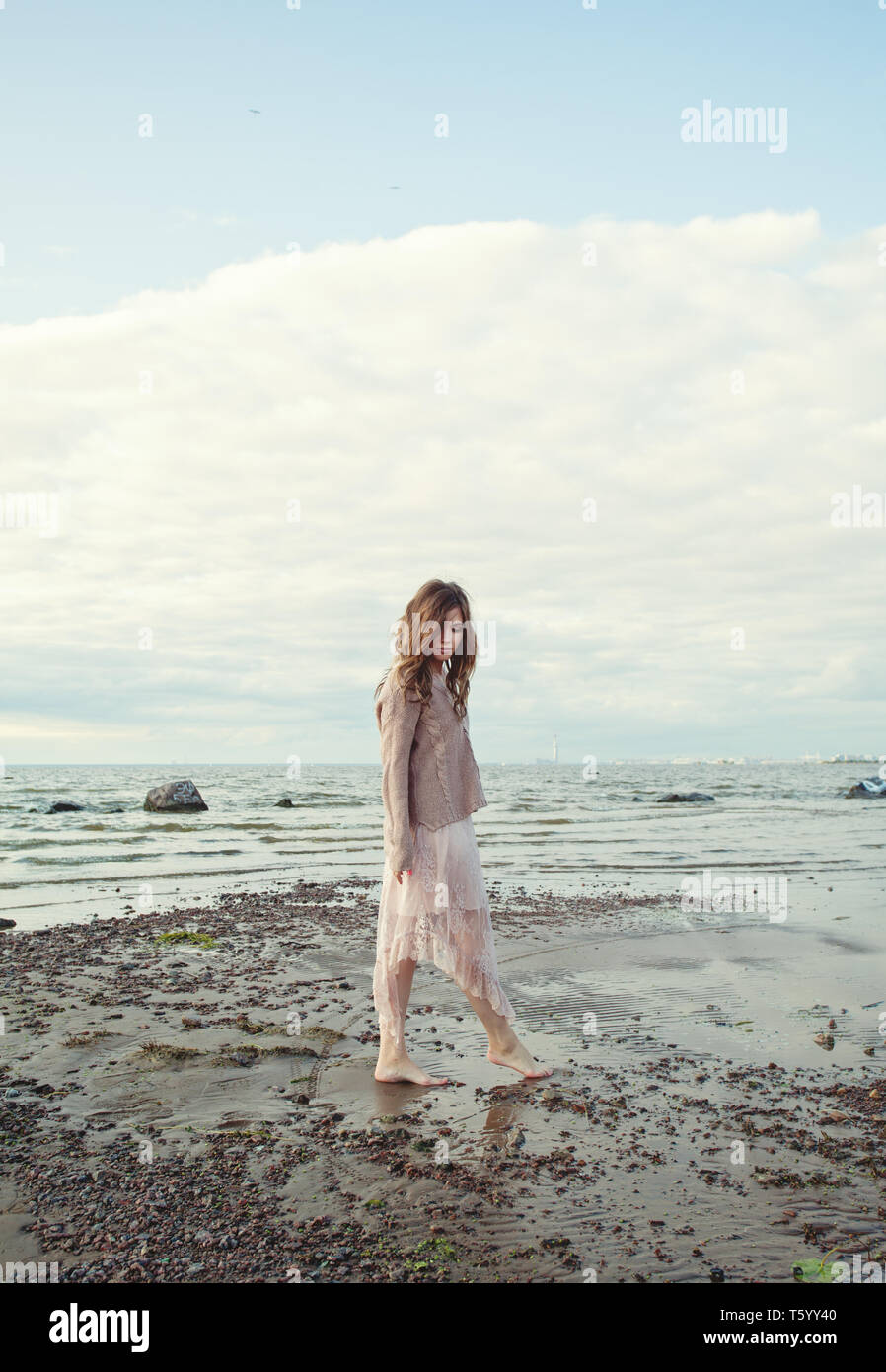 Outdoor portrait of pretty woman on ocean coast Stock Photo - Alamy
