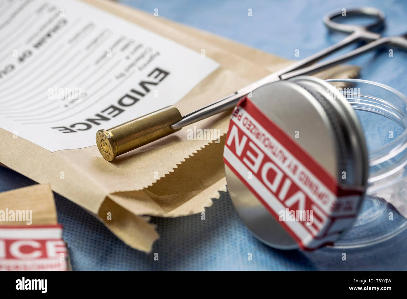 Bullet cap next to a test bag in ballistic Laboratory, conceptual image ...