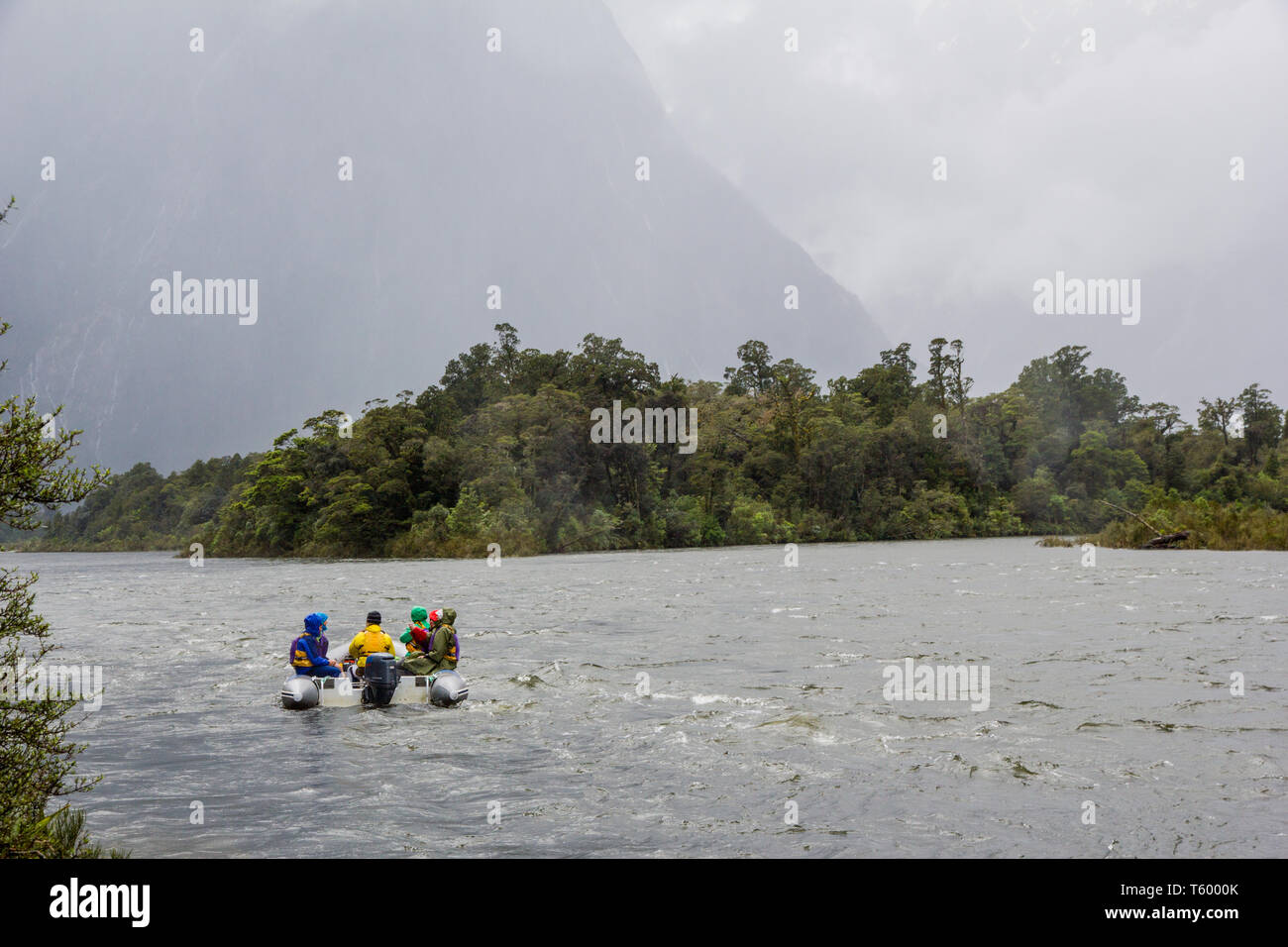 Inflatable boat takes hikers away from Sandfly Point - the end of the ...