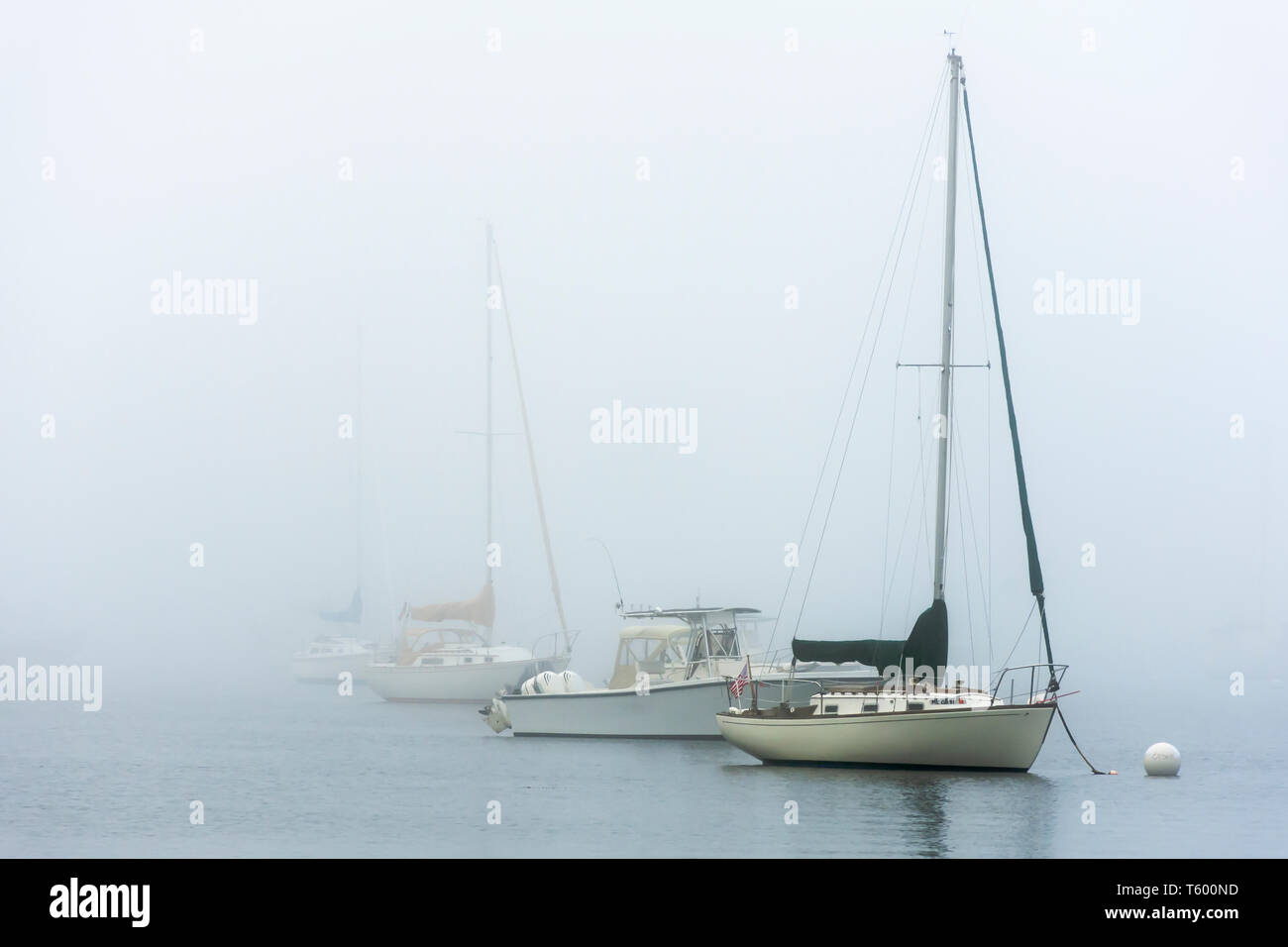 boats at anchor in fog boats at anchor in fog Stock Photo - Alamy