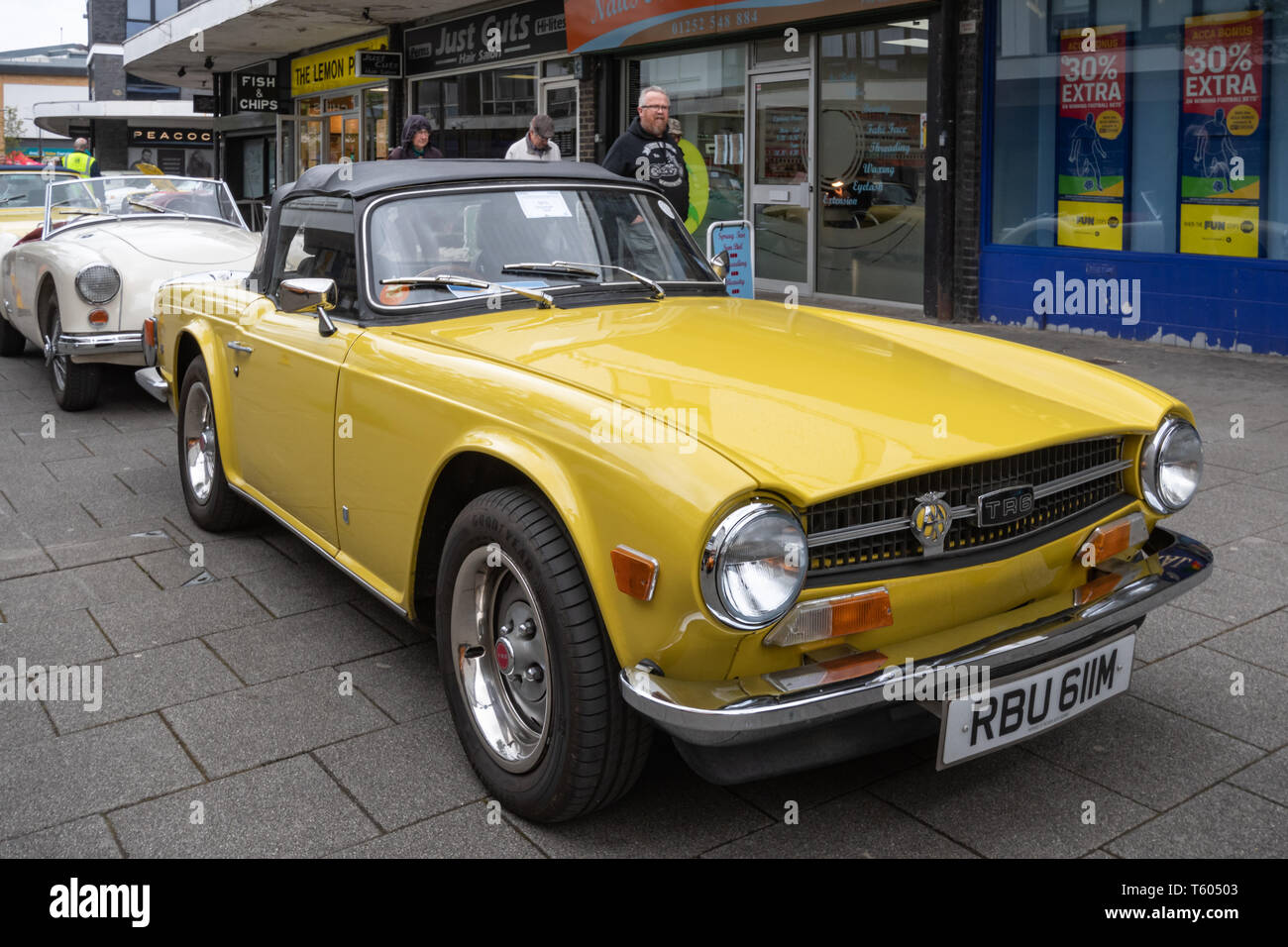 Yellow 1973 Triumph TR6 car at a classic motor vehicle show in the UK ...