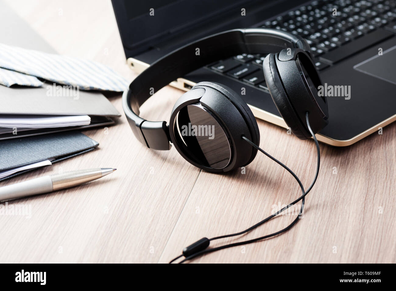 wired black headphone isolated on the desktop Stock Photo - Alamy