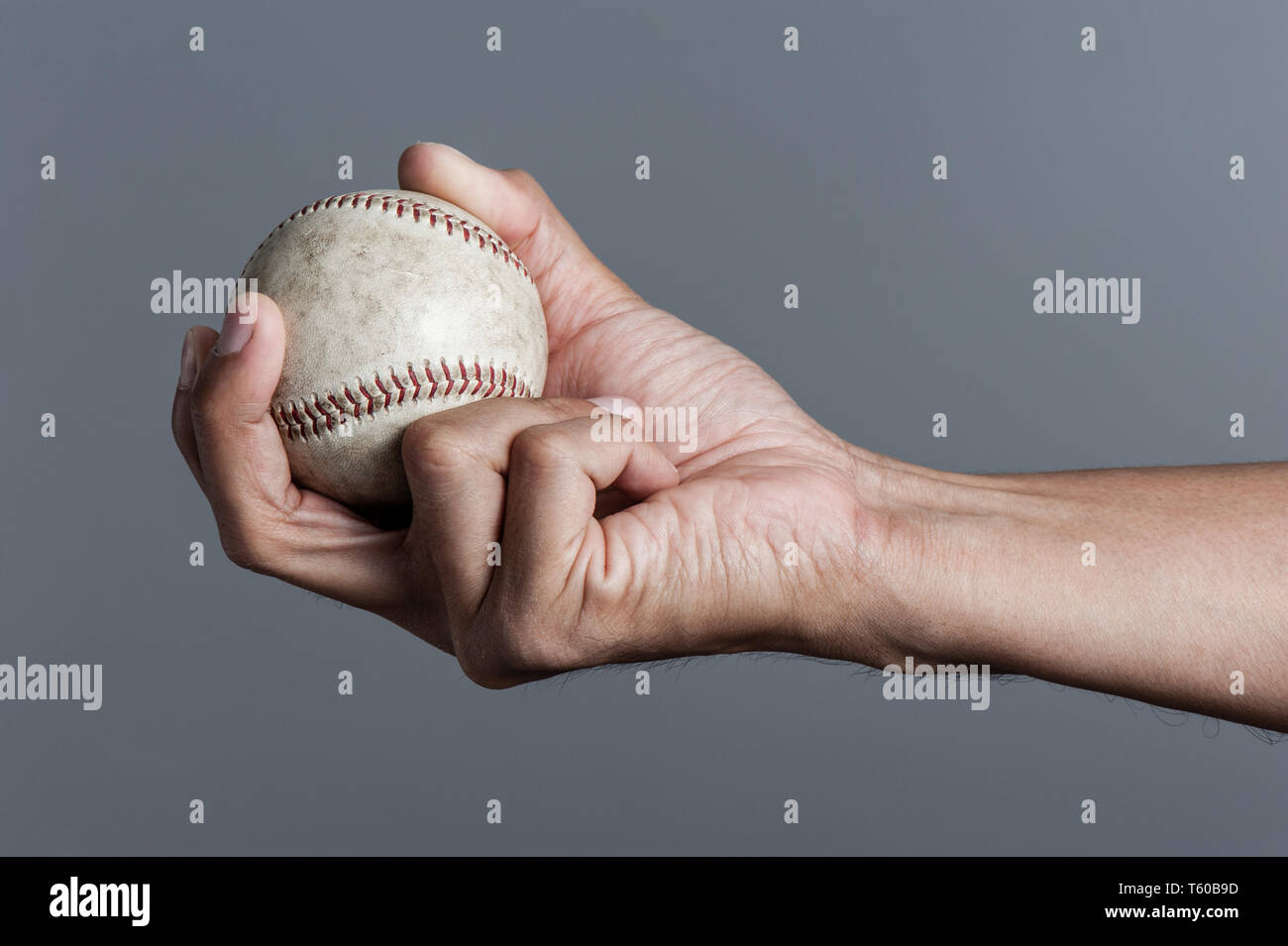 closeup baseball in man's hand, isolated over background Stock Photo ...
